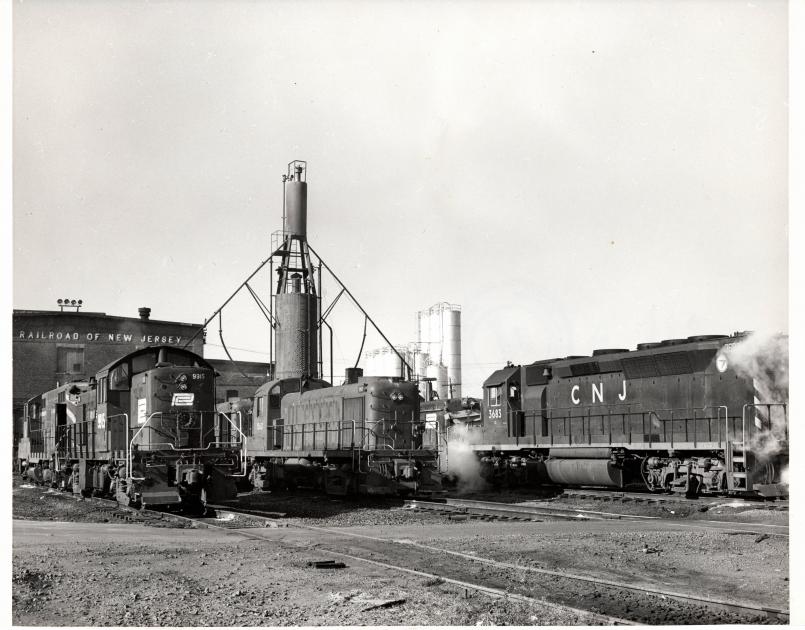 Photograph of RS1 9915, RS3 1563 and GP40P 3683 at E Port engine ...